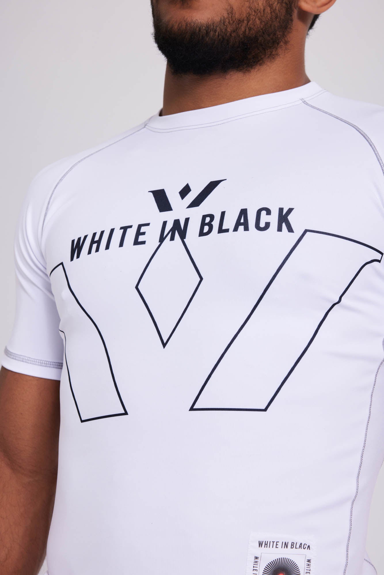 COLL1: White Rash Guard – White in Black